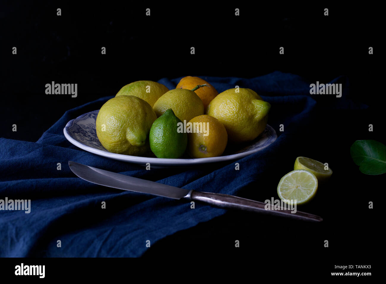Still life with lemons on plate hi-res stock photography and images - Alamy