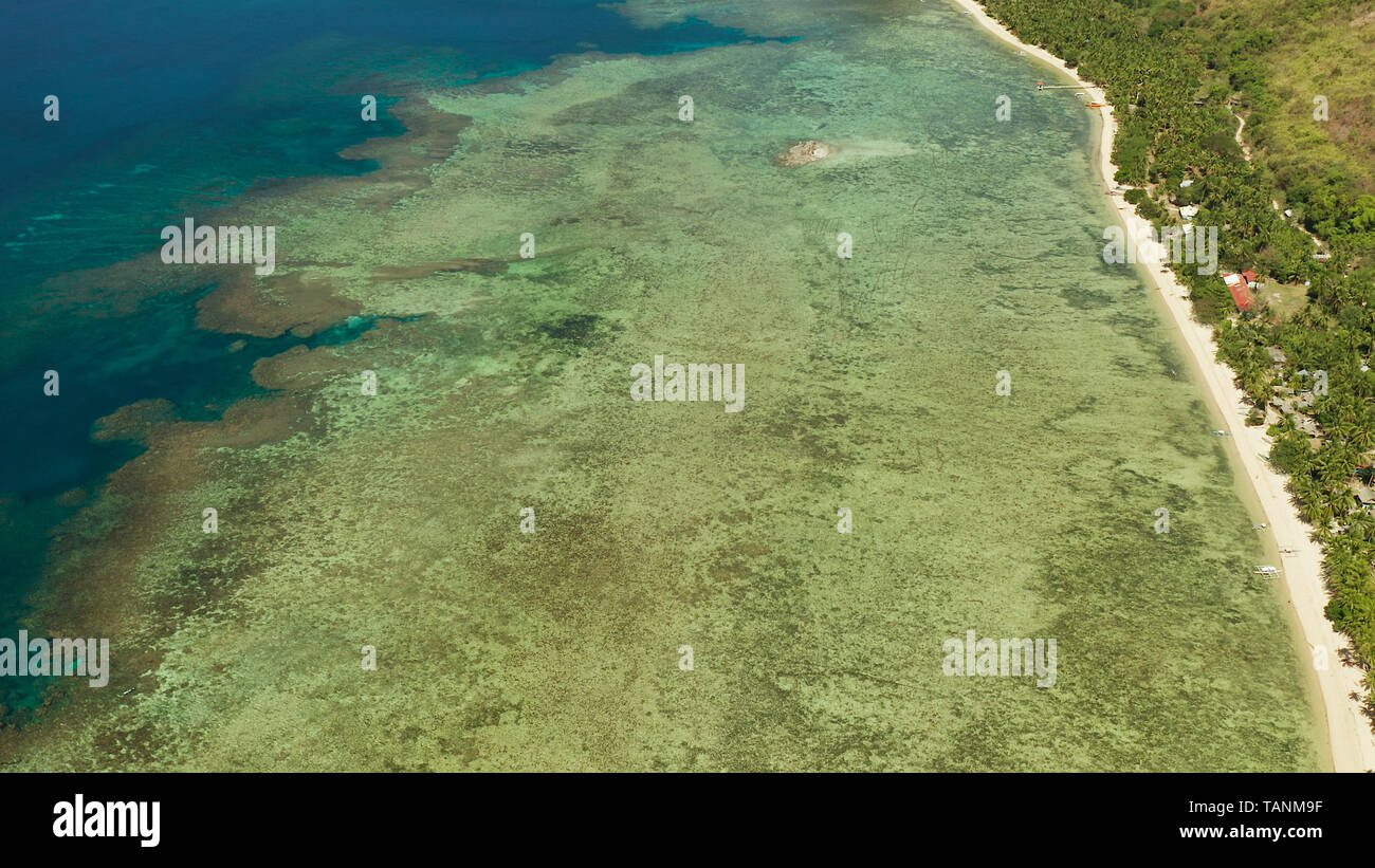 Aerial drone coastline of tropical island with beach, coral reef and ...