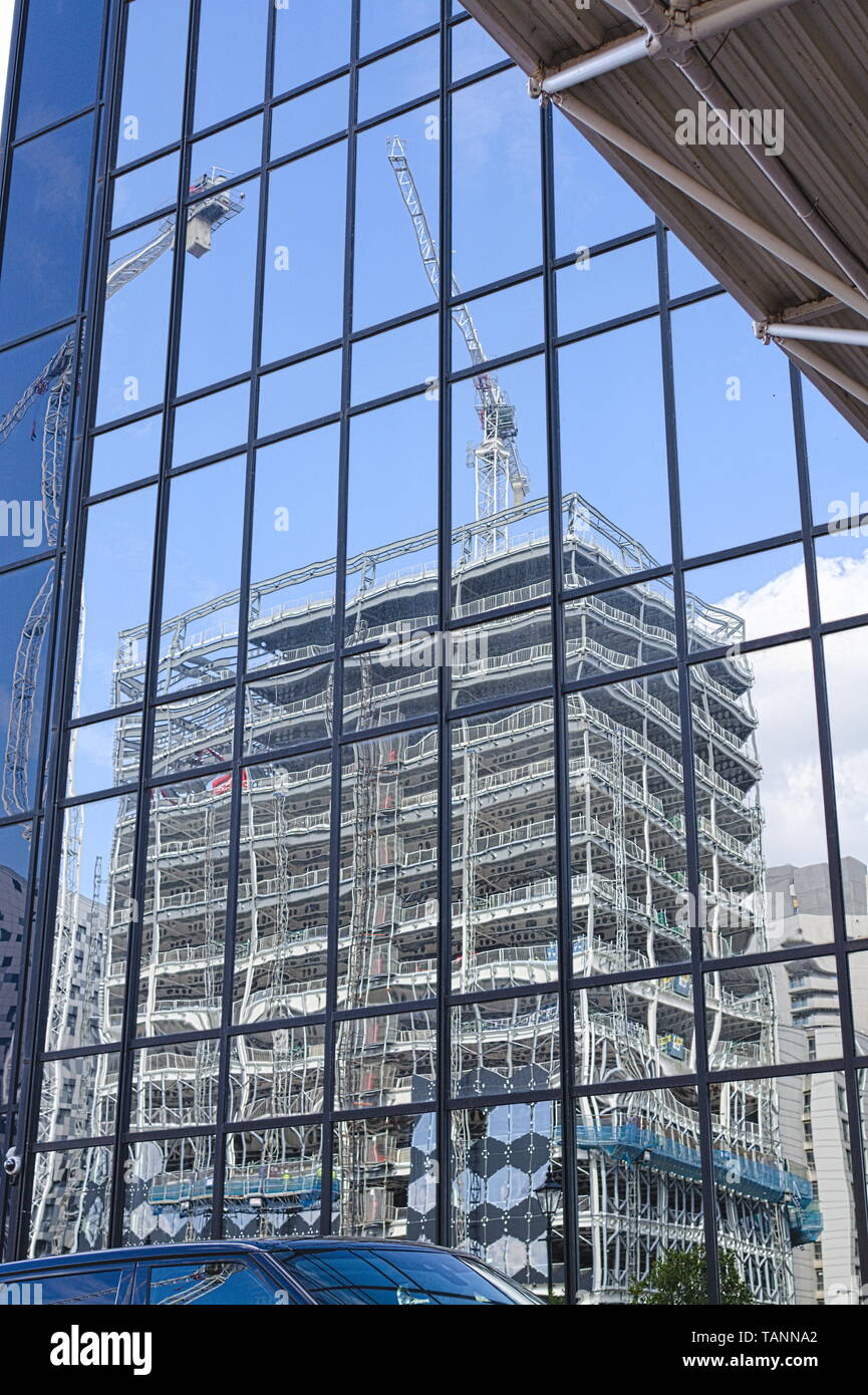 A mirror reflection of the building construction Stock Photo - Alamy