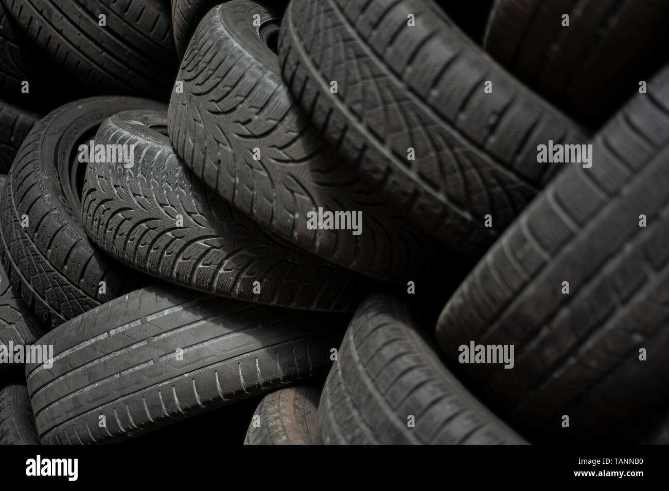 Stack of used car tyres Stock Photo - Alamy