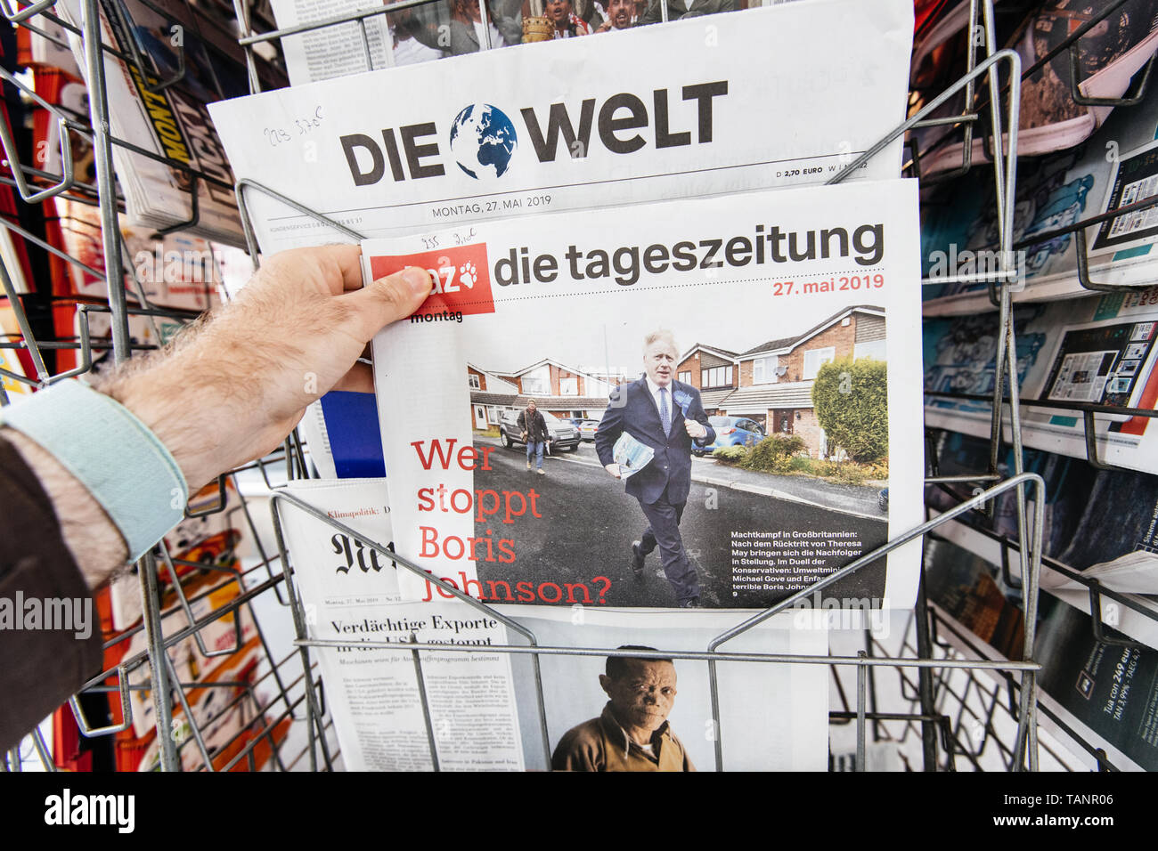 Strasbourg, France - May 27, 2019: Man holding buying newspaper Taz ...