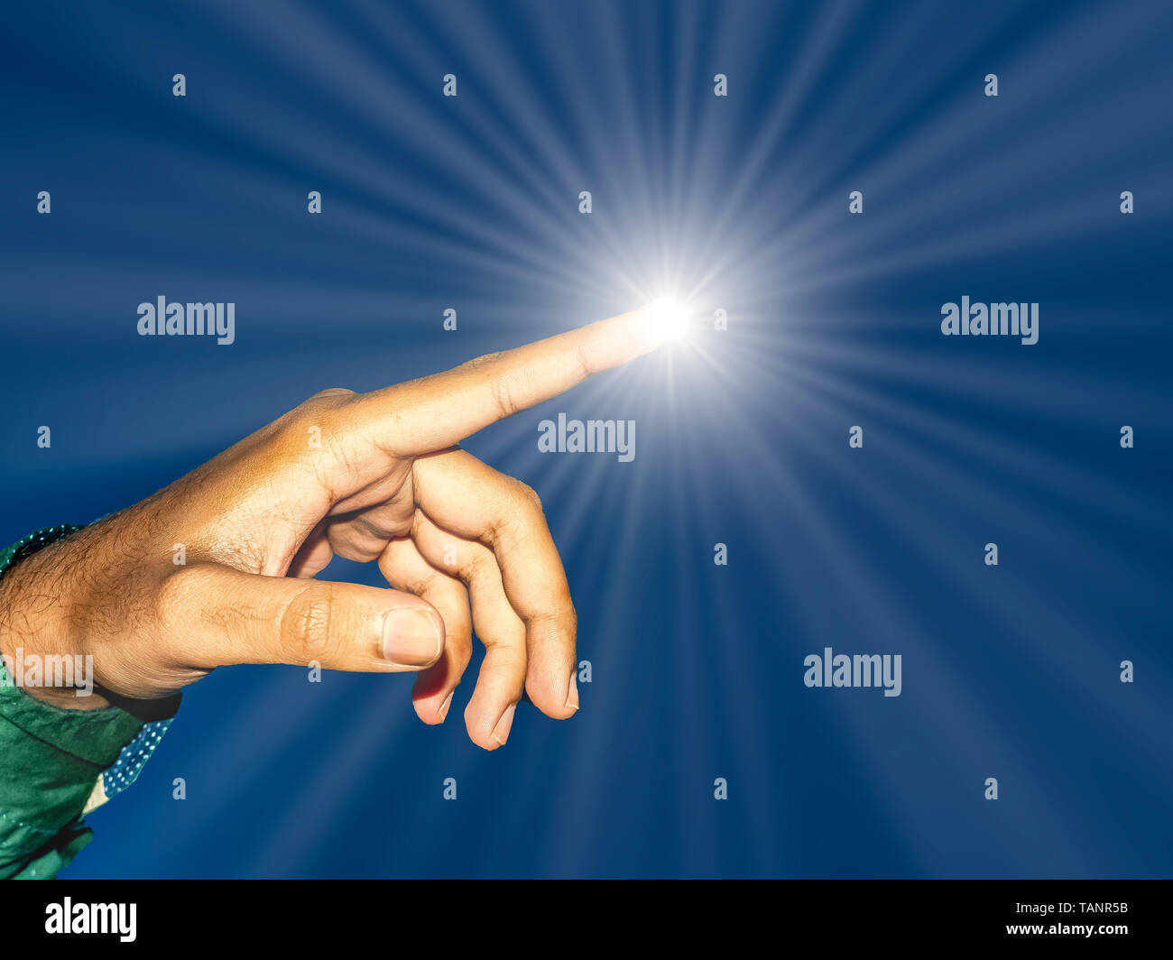 Close up of a young indian man hand pointing finger as touching screen ...