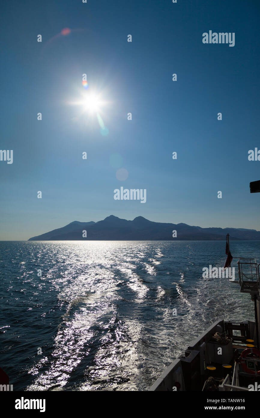 The isle of Rum seen from a calmac ferry Stock Photo - Alamy