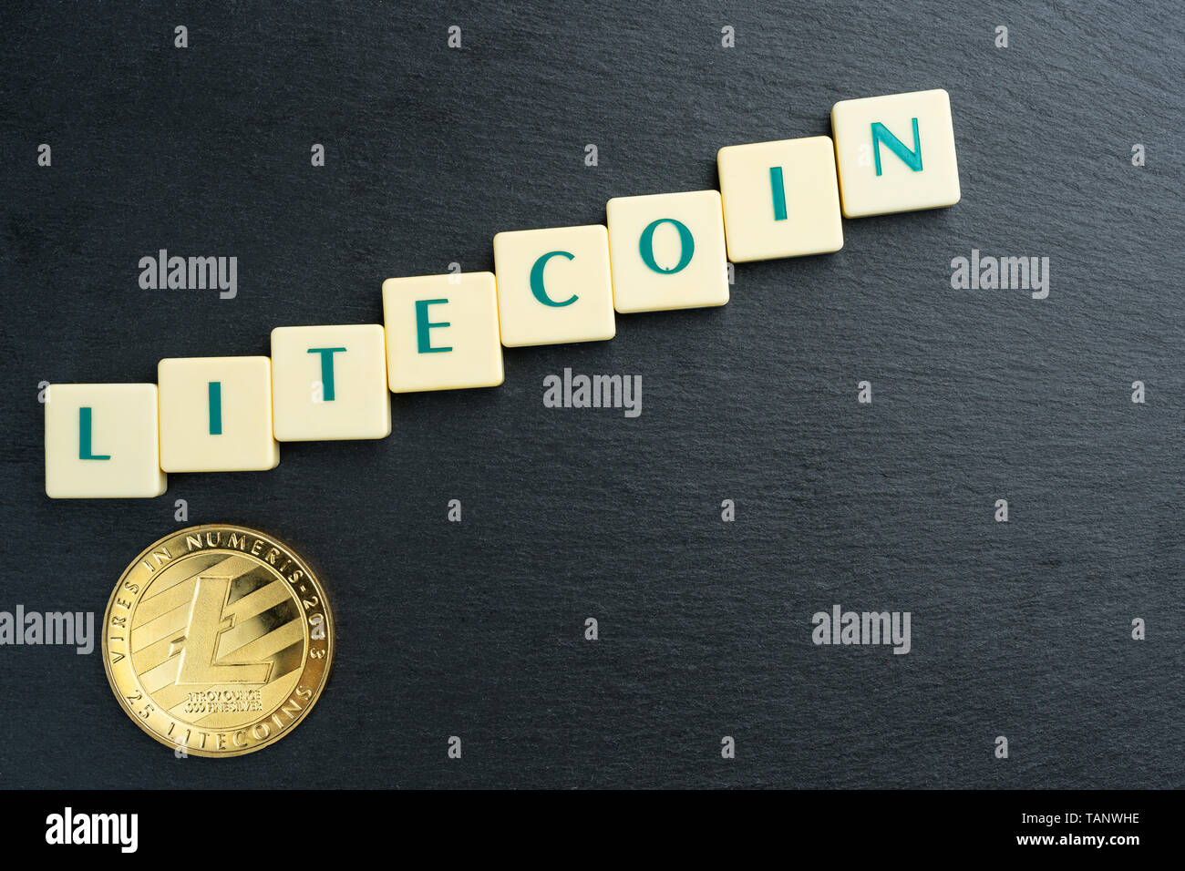 Physical Litecoin gold coin with text made out of letter tiles ...