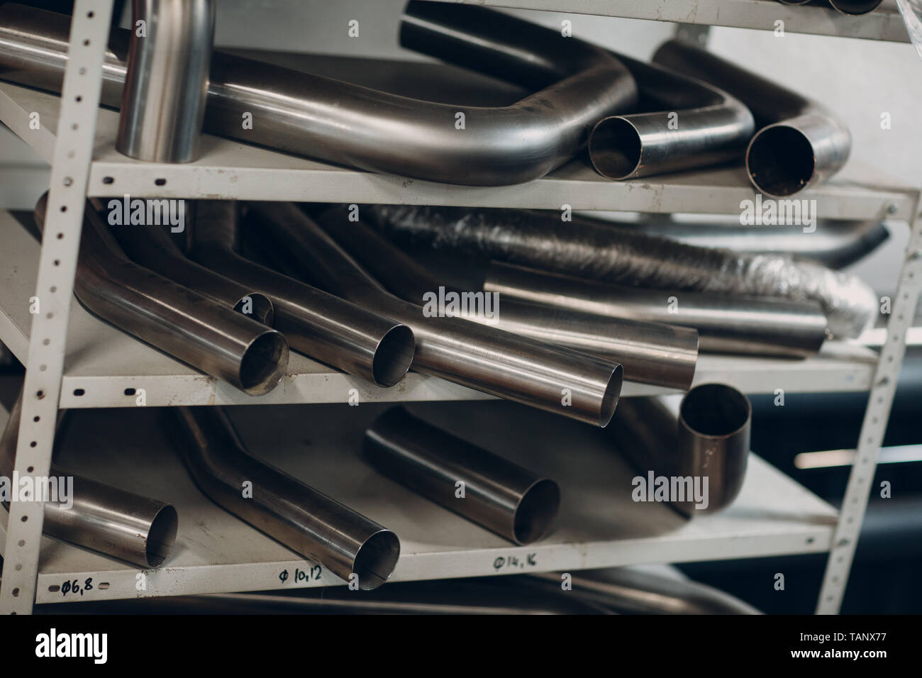 Titanium car exhaust custom pipe Stock Photo - Alamy