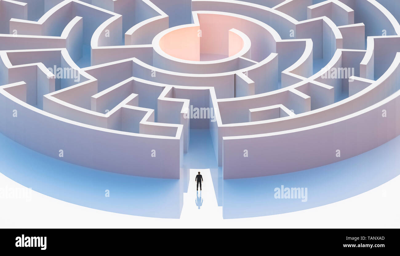 Man in suit standing in front of a circular or concentric maze entrance ...