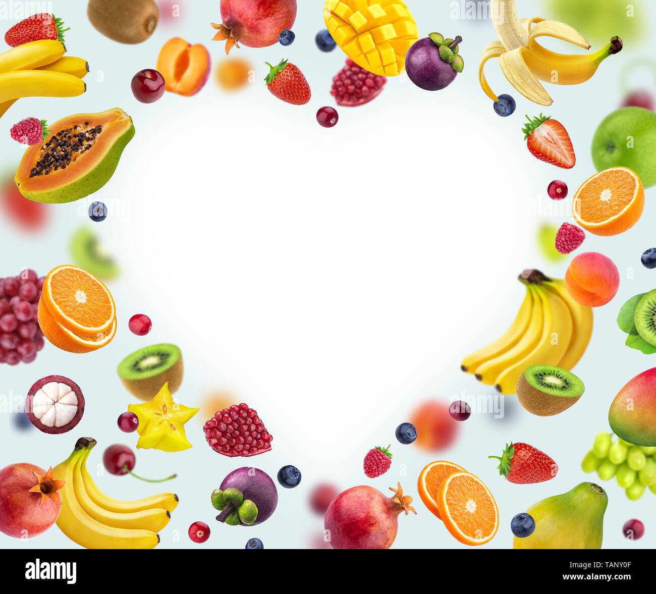 Heart shape frame made of different fruits and berries, isolated on ...