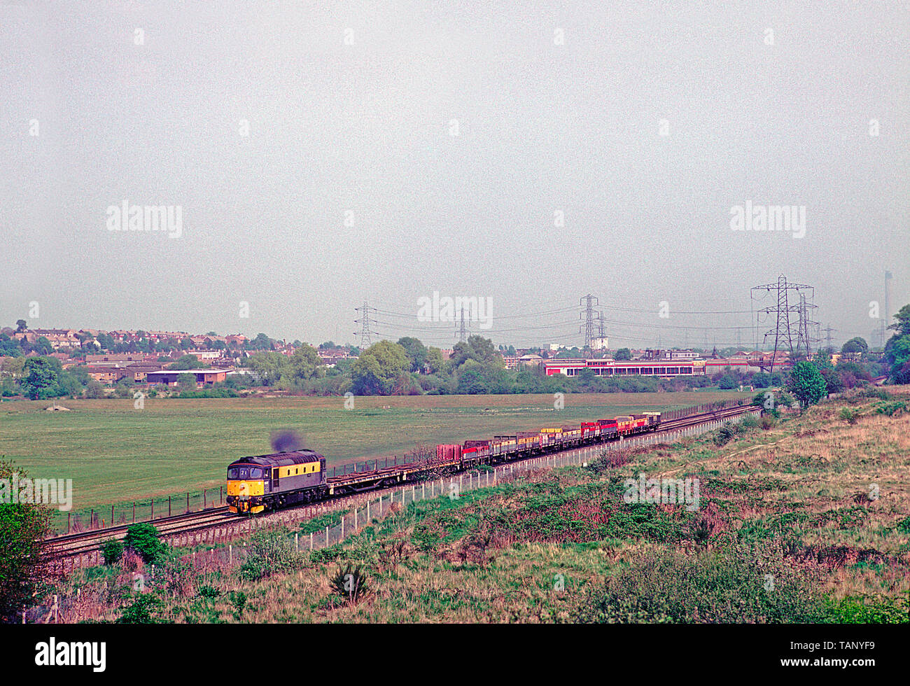 A class 33 Crompton locomotive number 33057 working a westbound ...