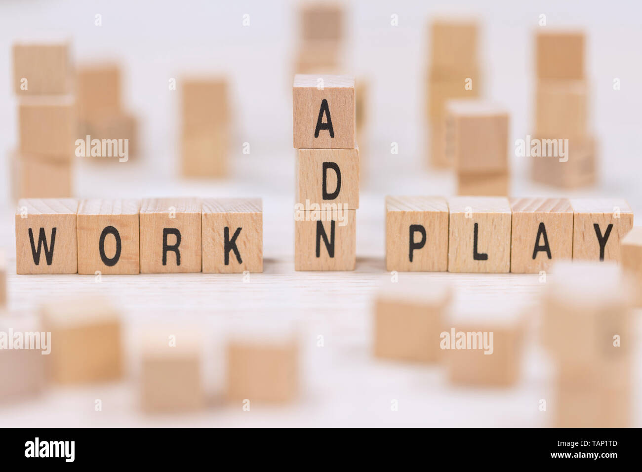 work and play wooden cubes background Stock Photo - Alamy