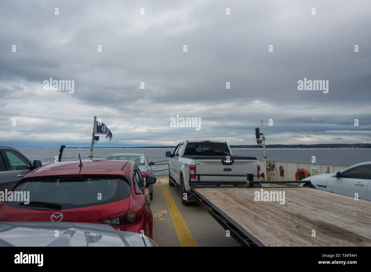 car ferry transporting vehicles across a body of water Stock Photo - Alamy