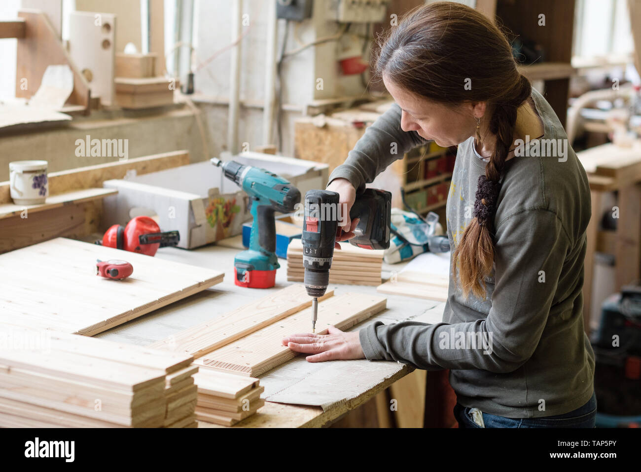 Worker using screwdriver on furniture hi-res stock photography and ...