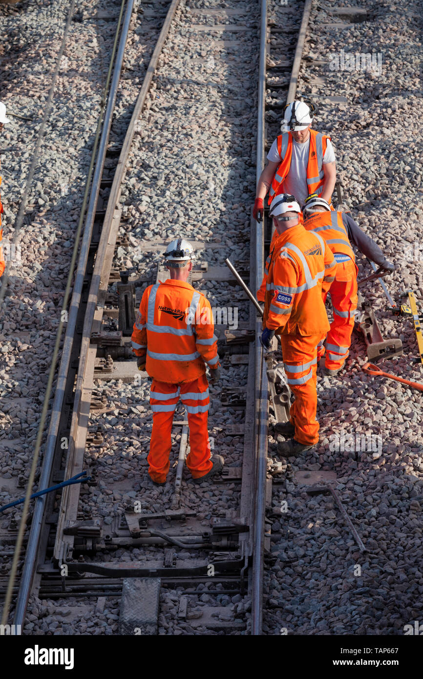 Network rail contractors and a Supervisor clearing excess ballast from ...