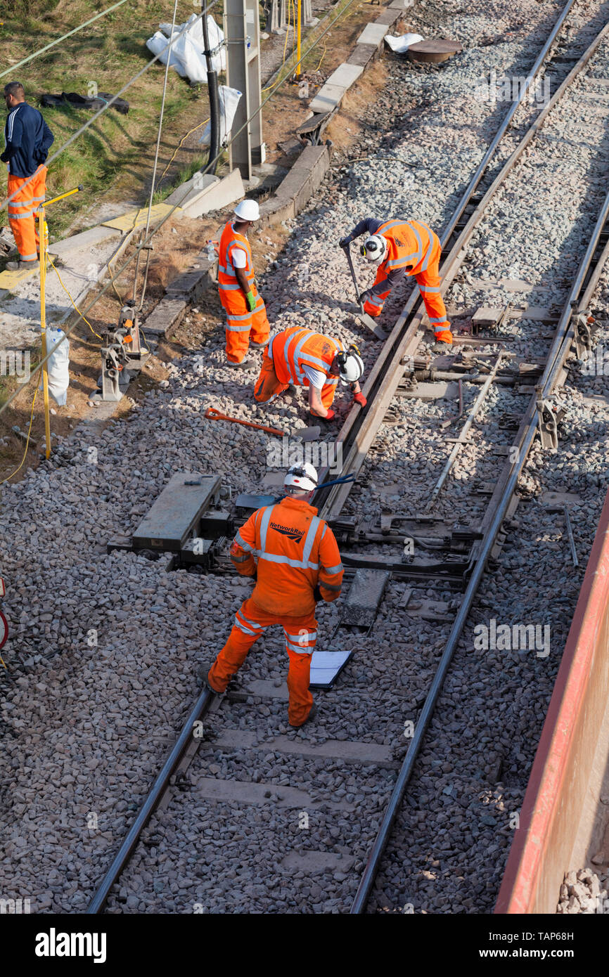 Network rail contractors and a Supervisor clearing excess ballast from ...