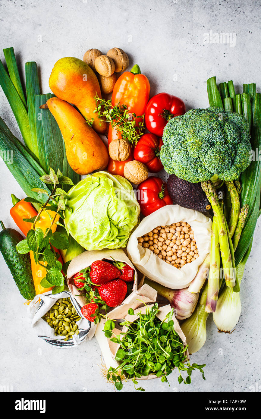 Balanced vegetarian food background. Vegetables, fruits, nuts, sprouts ...