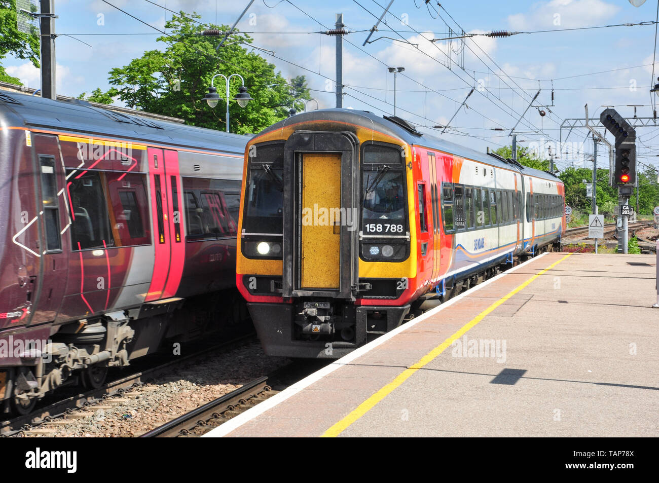 East Midlands class 158 DMU pulls into platform 2 while a Cross Country ...
