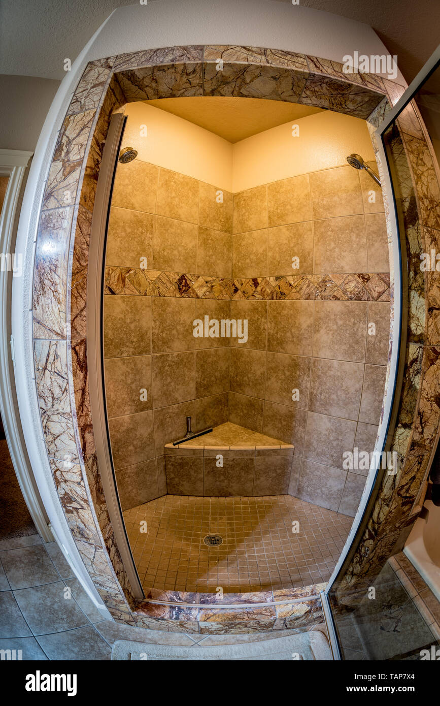 Fancy shower in high end construction that is tan in color Stock Photo ...