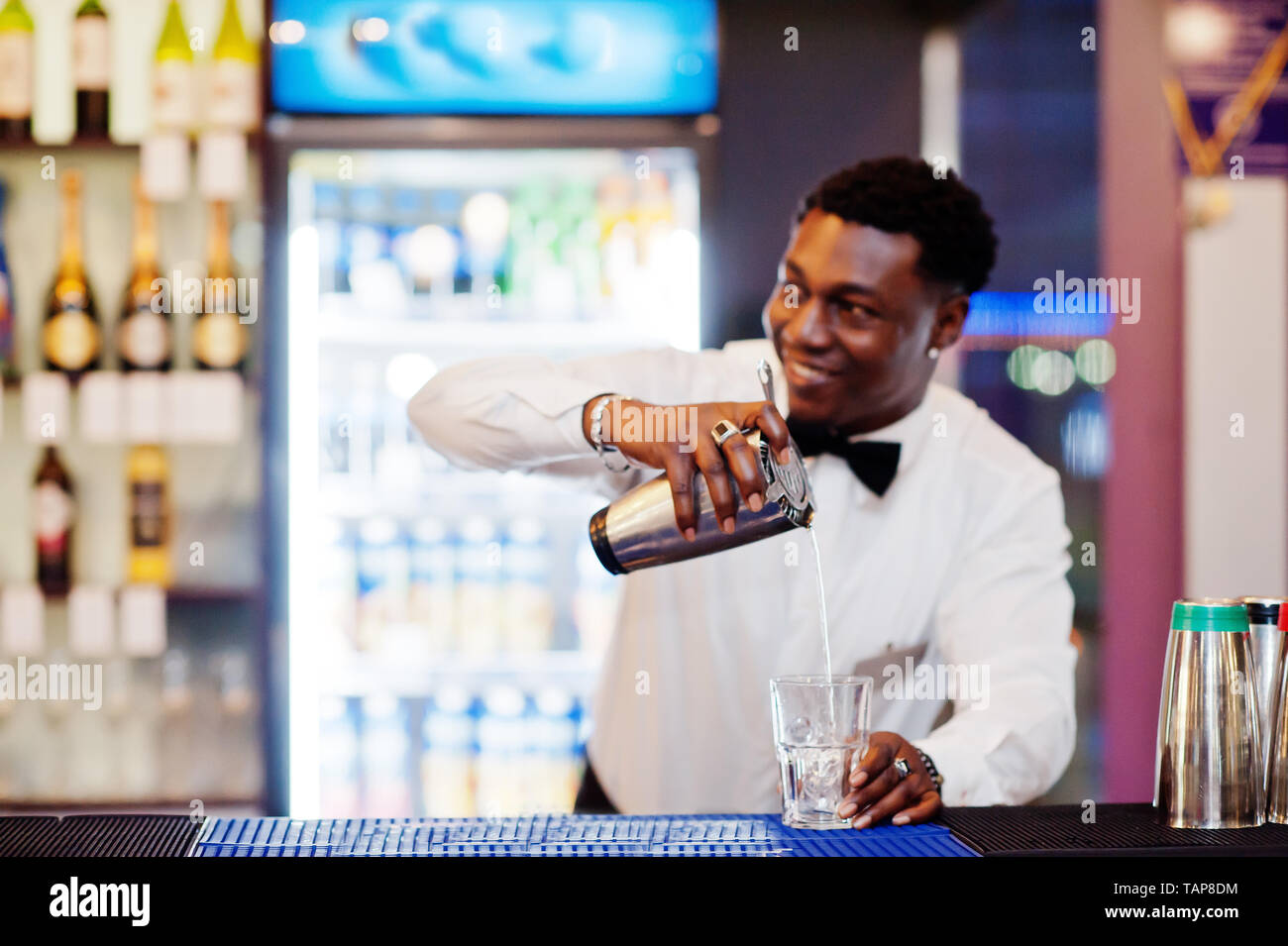 African american bartender at bar with shaker. Alcoholic beverage ...