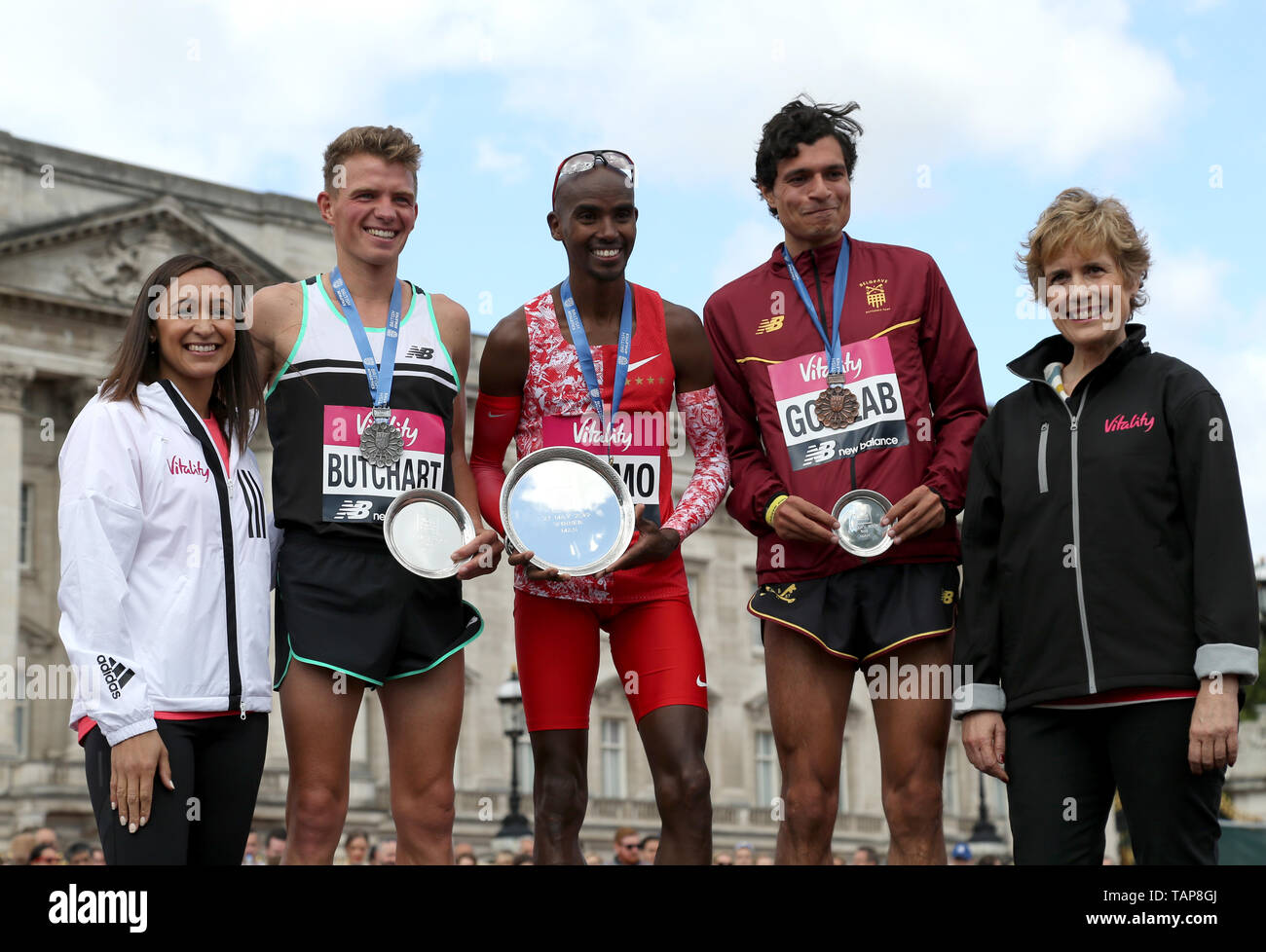 Celebrates winning mens elite race alongside second placed andy ...