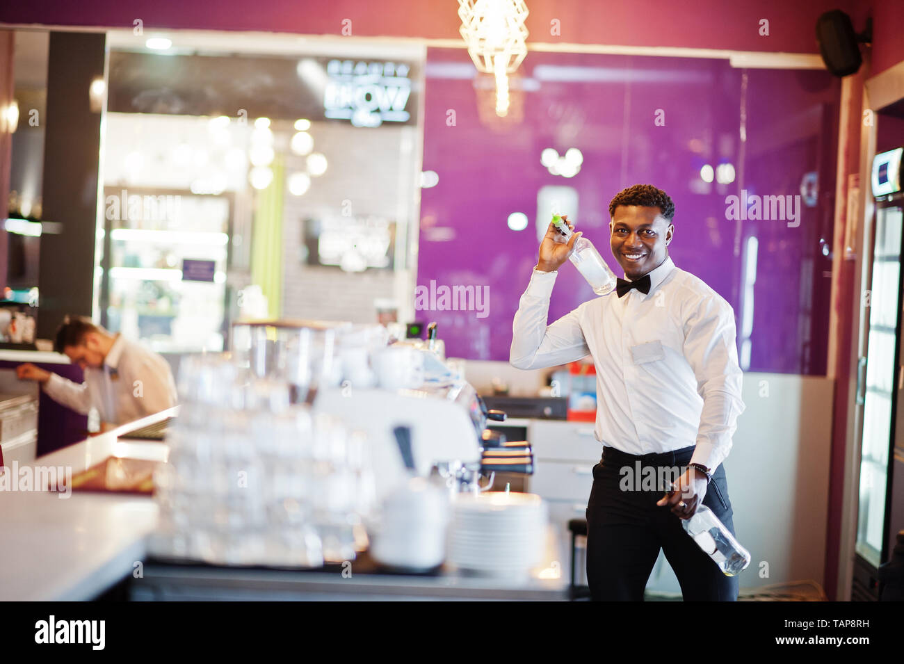 African american bartender at bar flair in action, working behind the ...