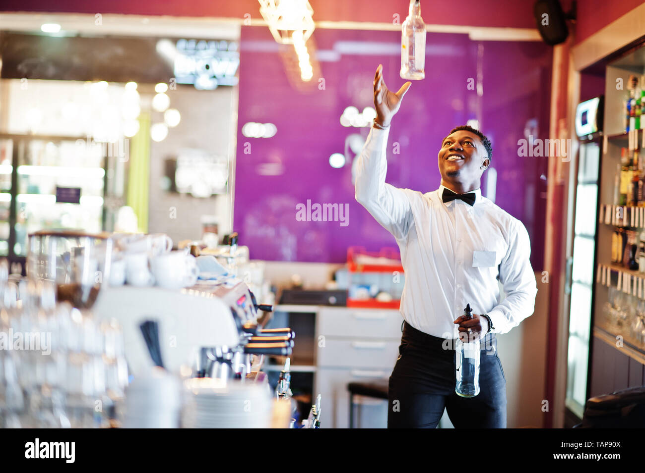 African american bartender at bar flair in action, working behind the ...