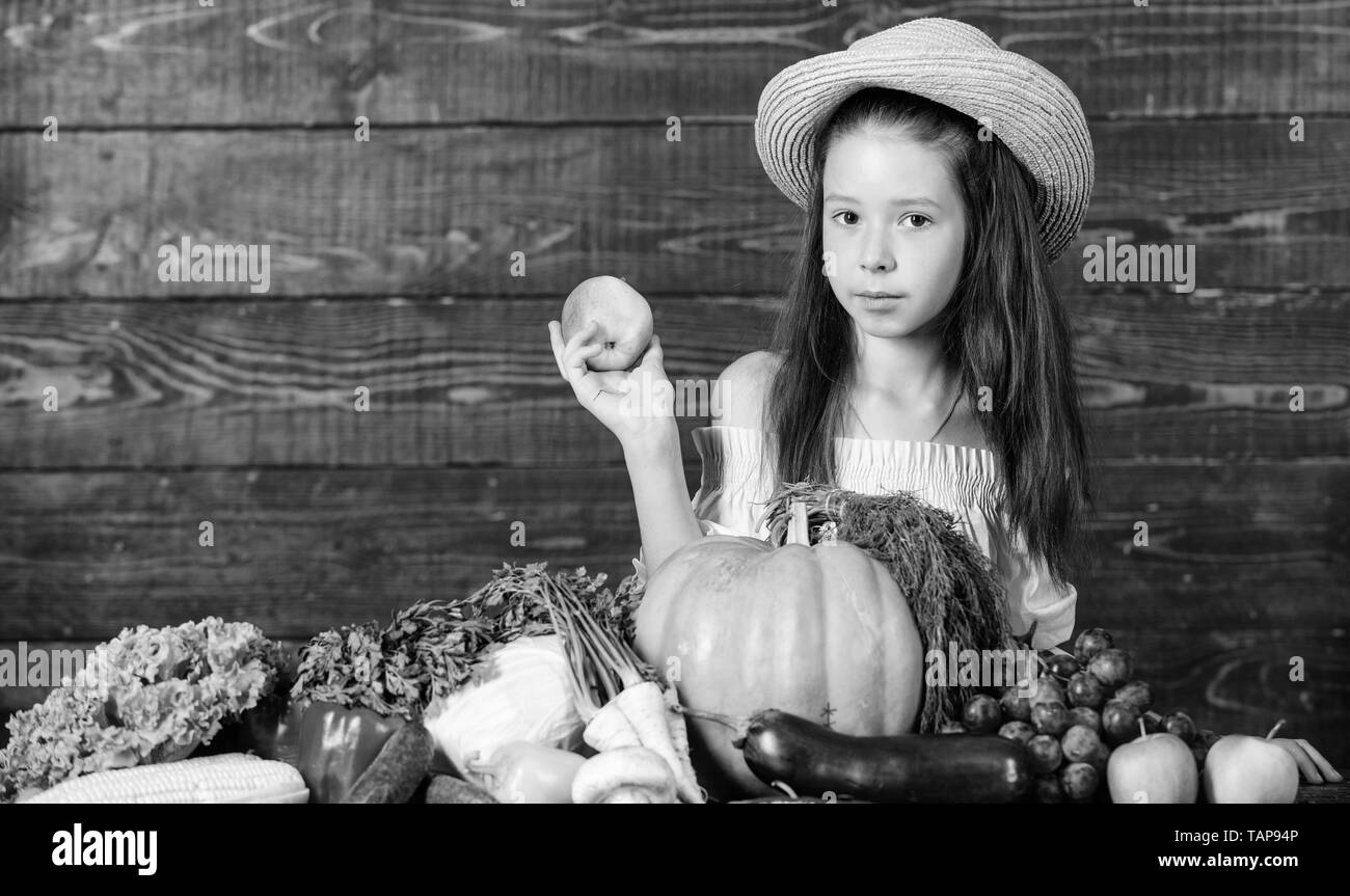 Girl kid farm market with fall harvest. Kid farmer with harvest wooden ...