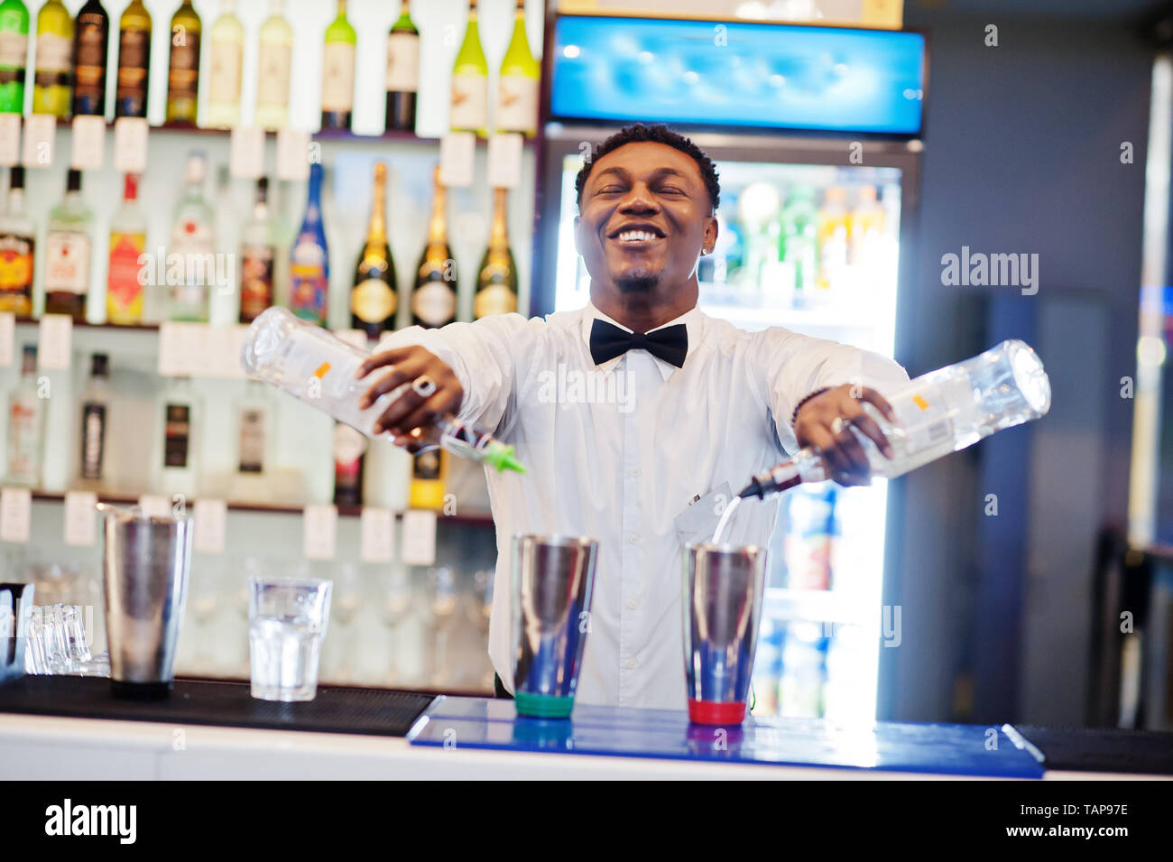 Bartender bottle behind bar hi-res stock photography and images - Alamy