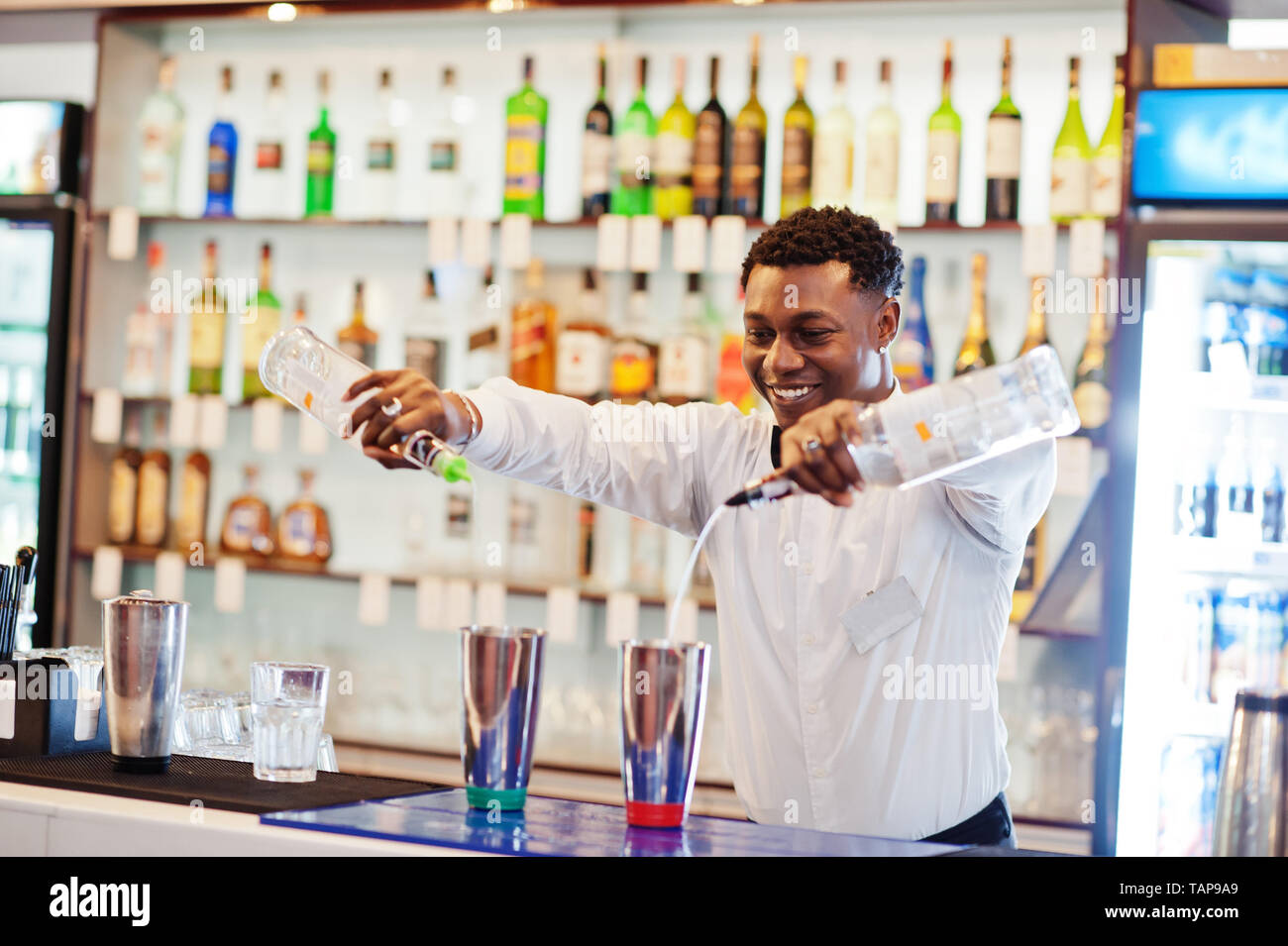 Bartender bottle behind bar hi-res stock photography and images - Alamy