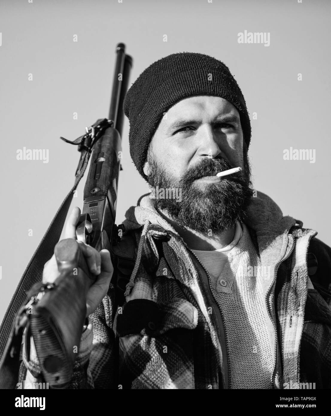 Hunter with rifle gun close up. Guy bearded hunter spend leisure ...