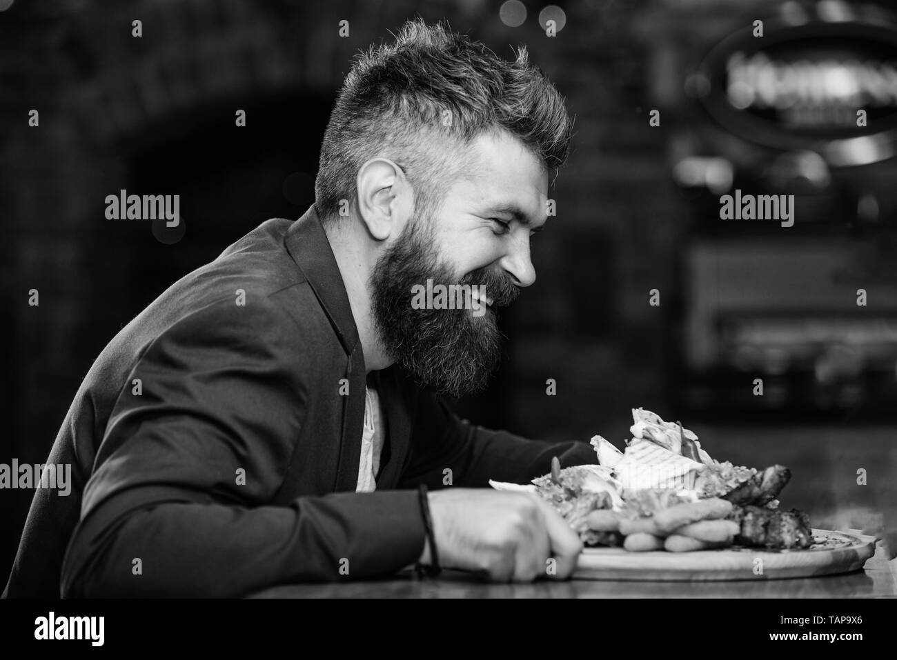 Hipster hungry eat pub fried food. Manager formal suit sit at bar ...