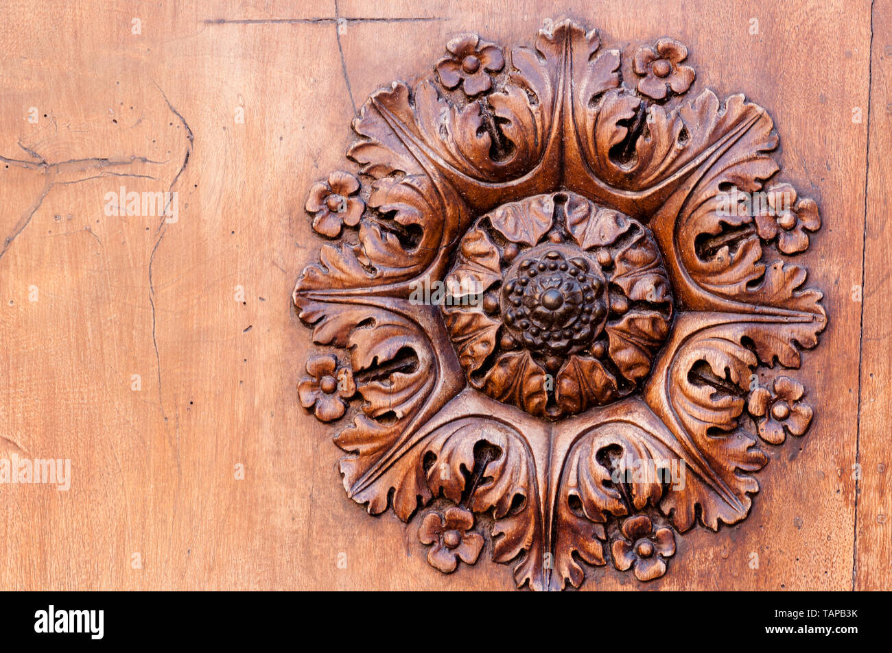 Detail embossed metal handle and an old door Stock Photo - Alamy
