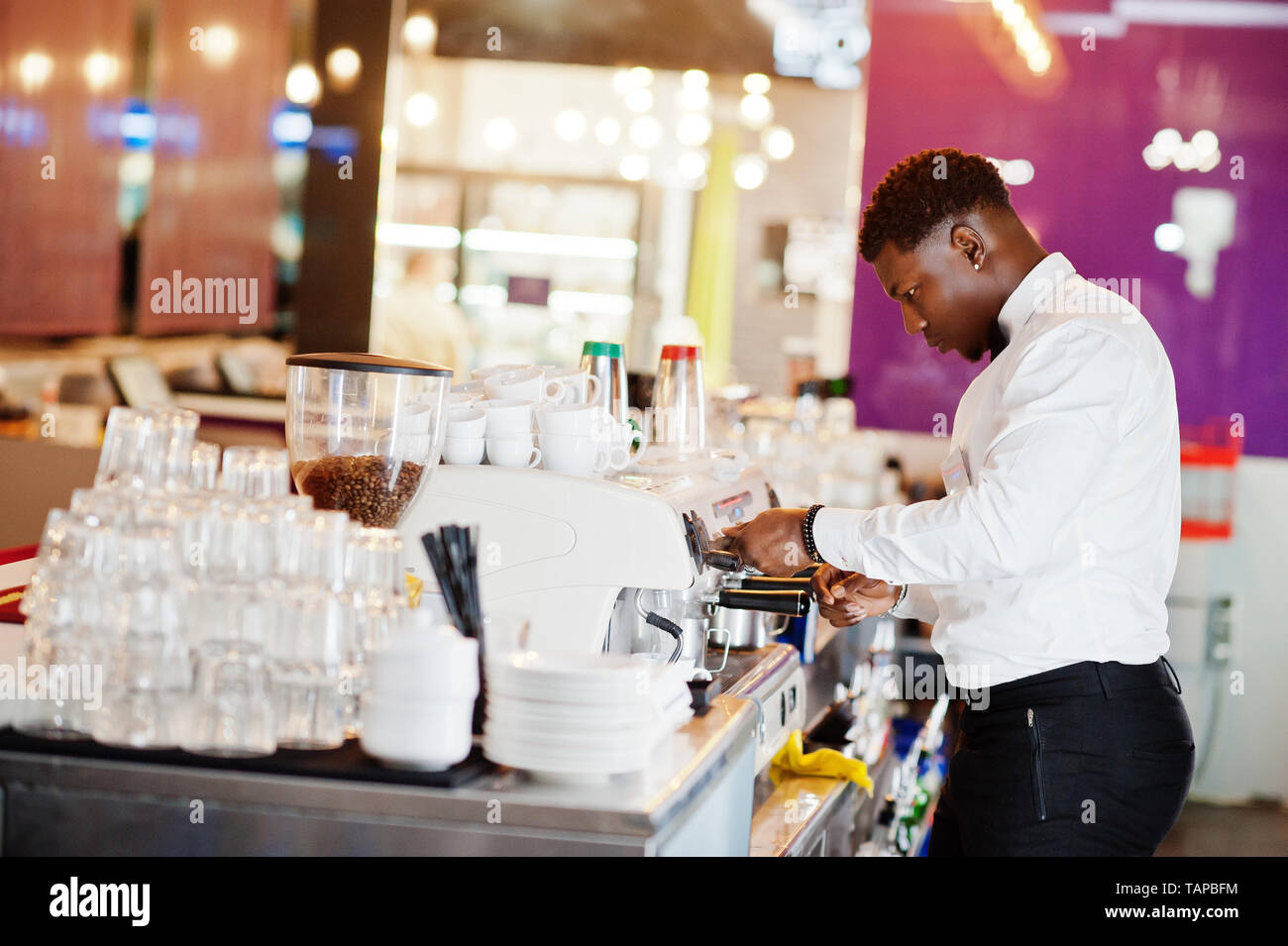 African american bartender barista at bar preparing coffee Stock Photo ...