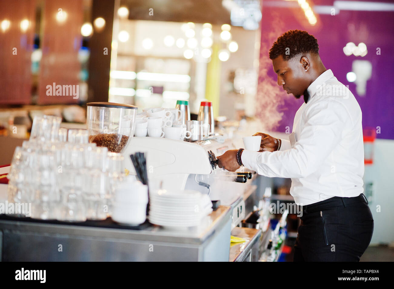 African american bartender barista at bar preparing coffee Stock Photo ...