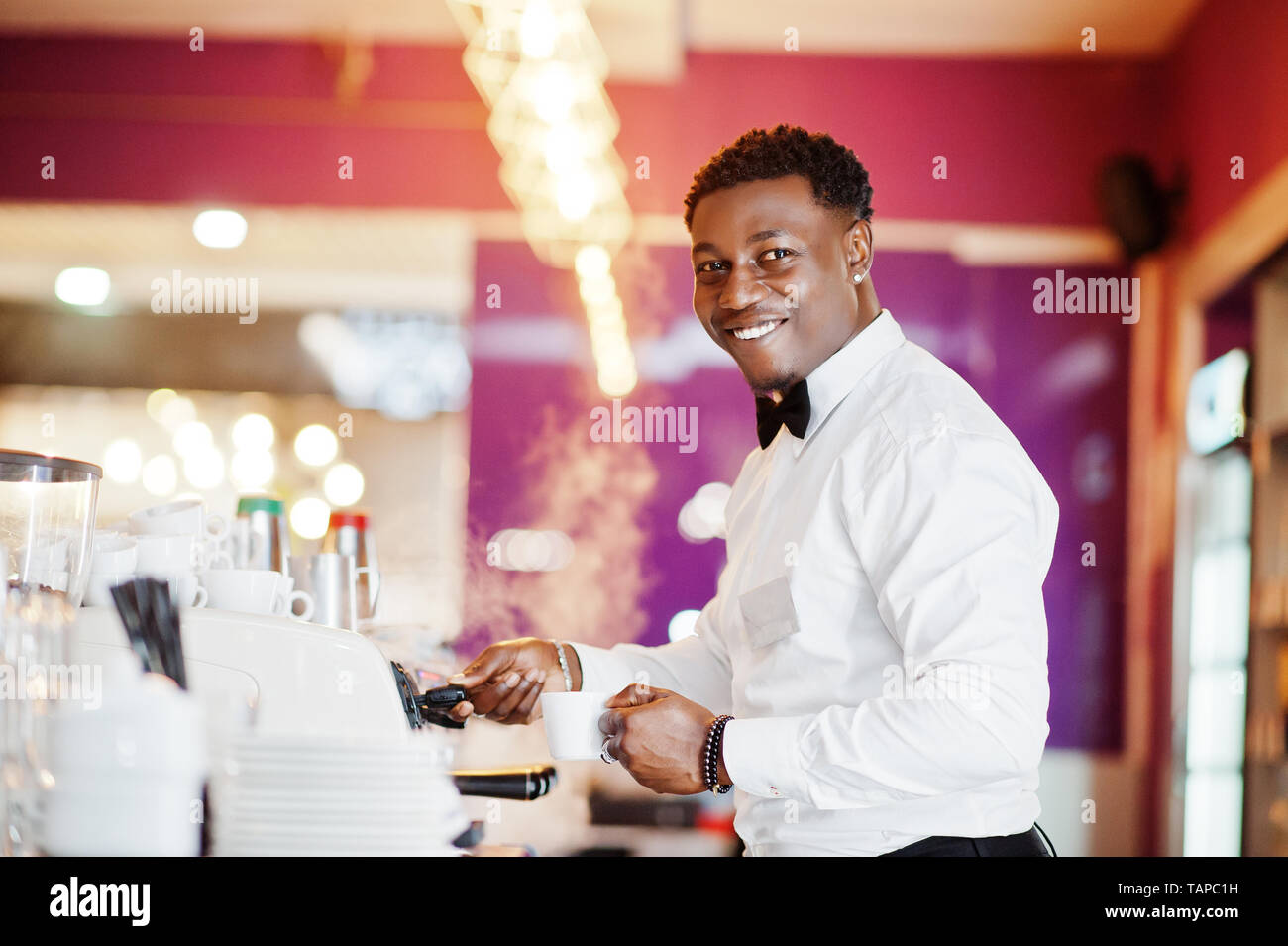 African american bartender barista at bar preparing coffee Stock Photo ...