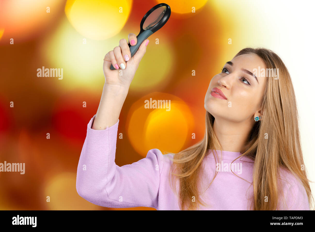 Woman with magnifying glass Stock Photo - Alamy