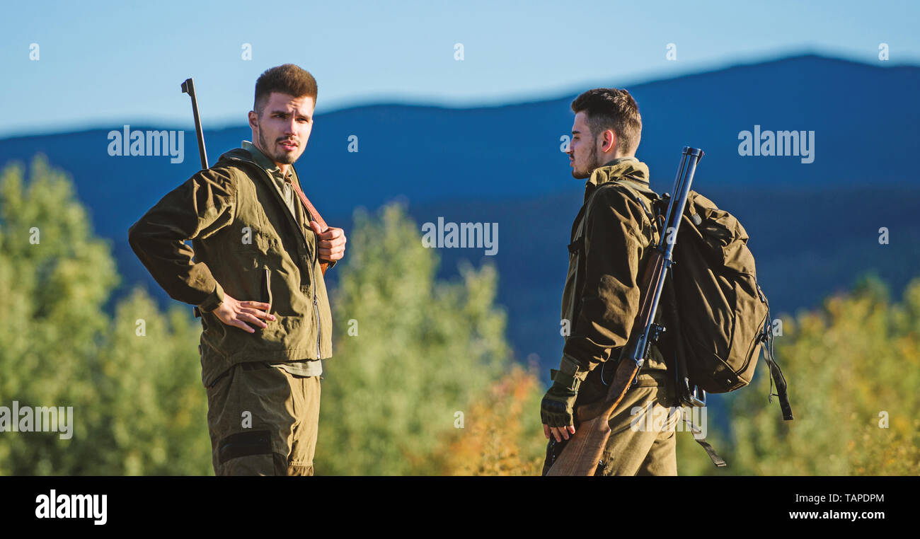 Man hunters with rifle gun. Boot camp. Friendship of men hunters. Army ...
