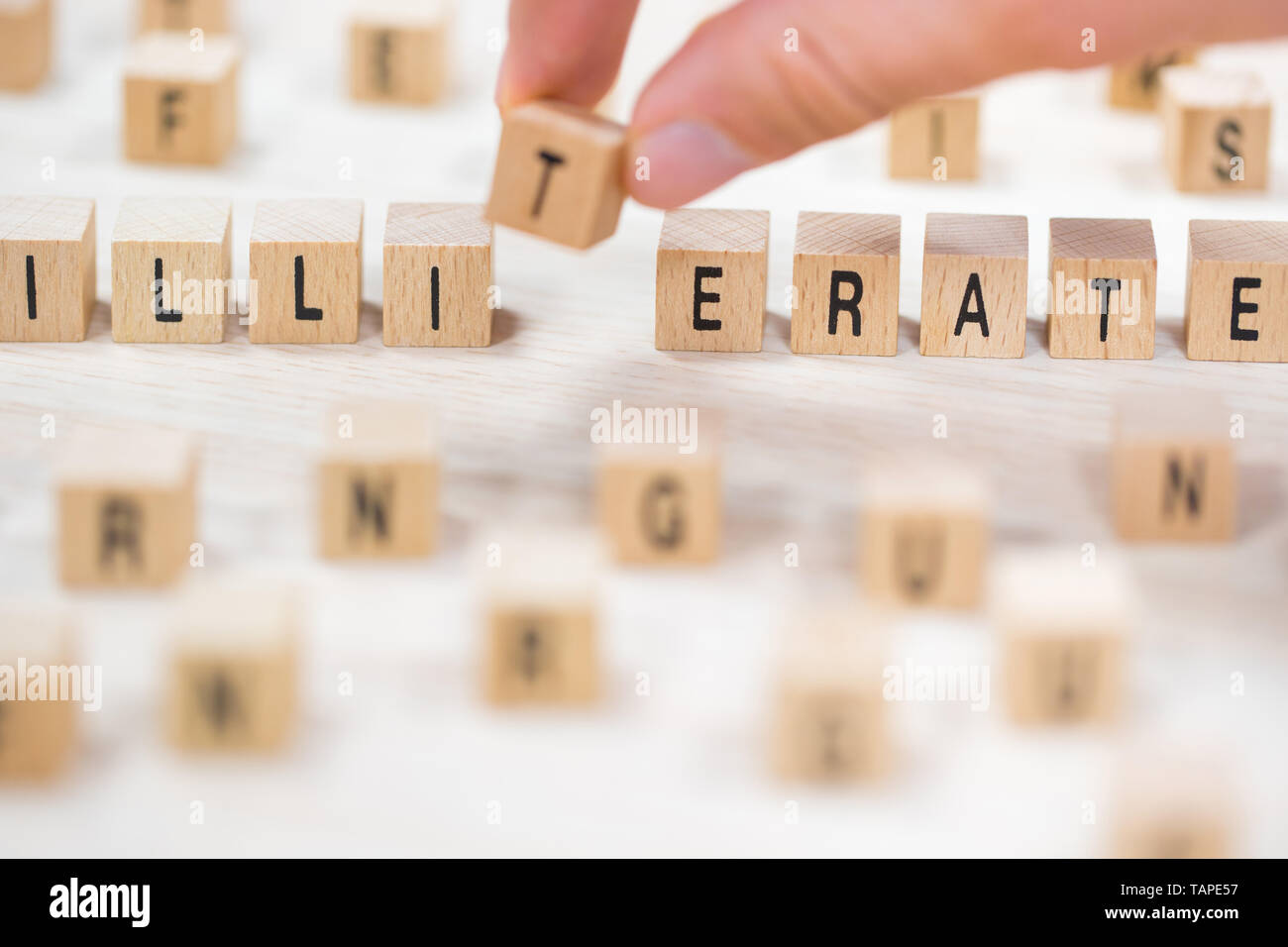 illiterate wooden cubes background Stock Photo - Alamy