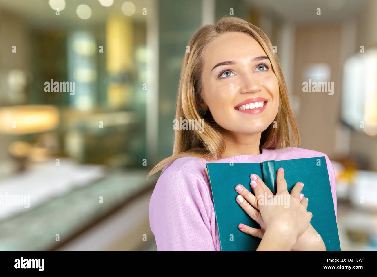 Woman with book Stock Photo - Alamy