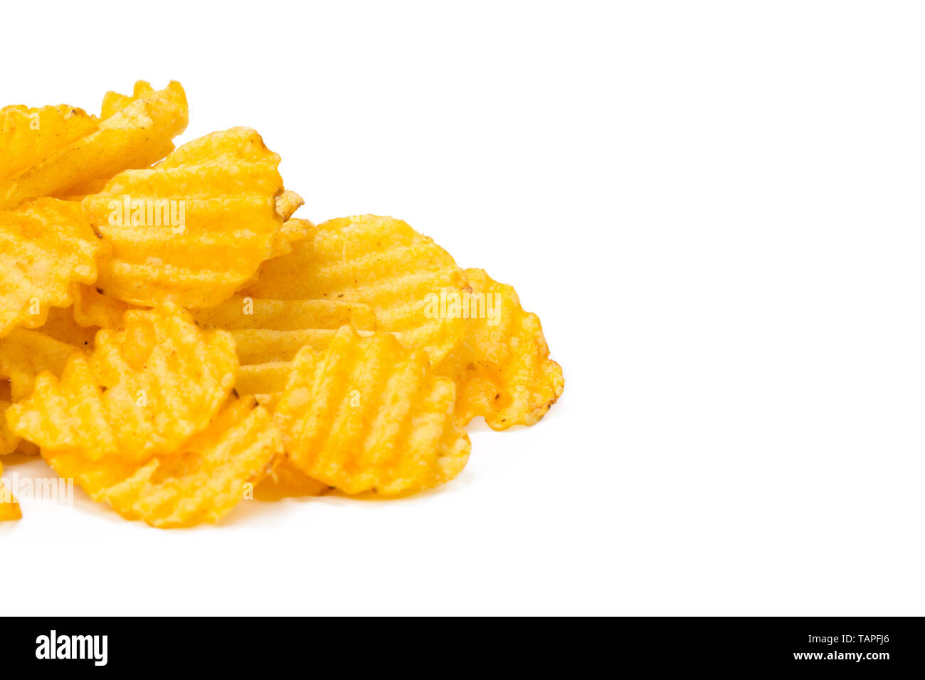 yellow potato chips isolated on white Stock Photo - Alamy