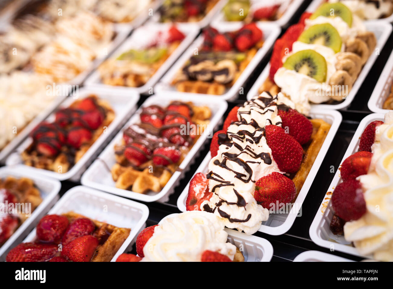 Brussels and Liege Waffles on display Stock Photo - Alamy