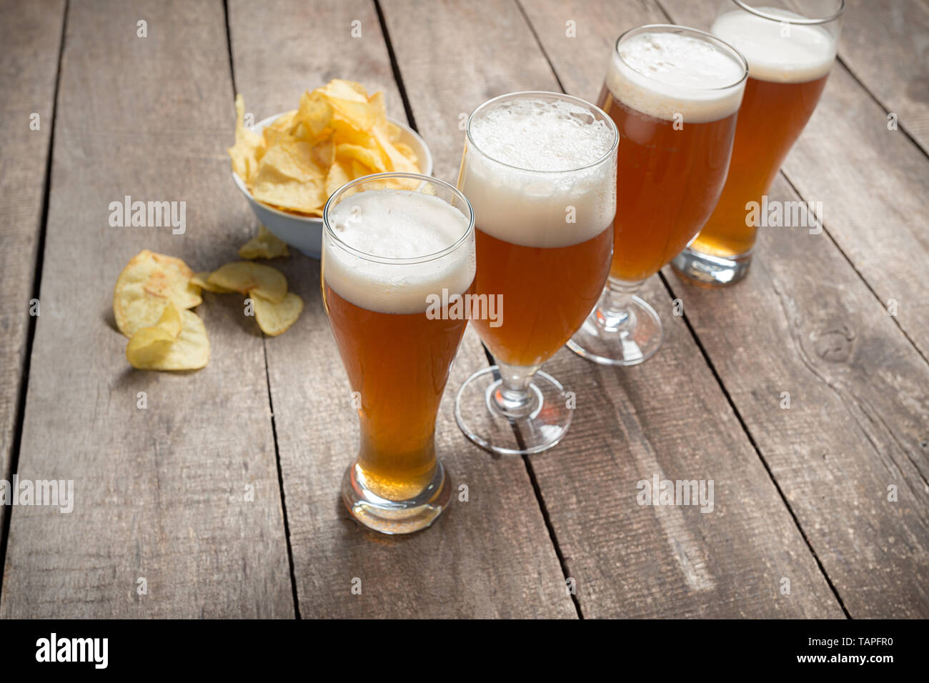 glass beer on wood background Stock Photo - Alamy