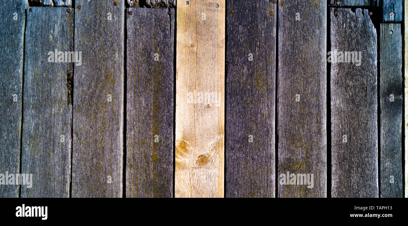 Top down view of old wooden pier planks forming wooden textured pattern ...