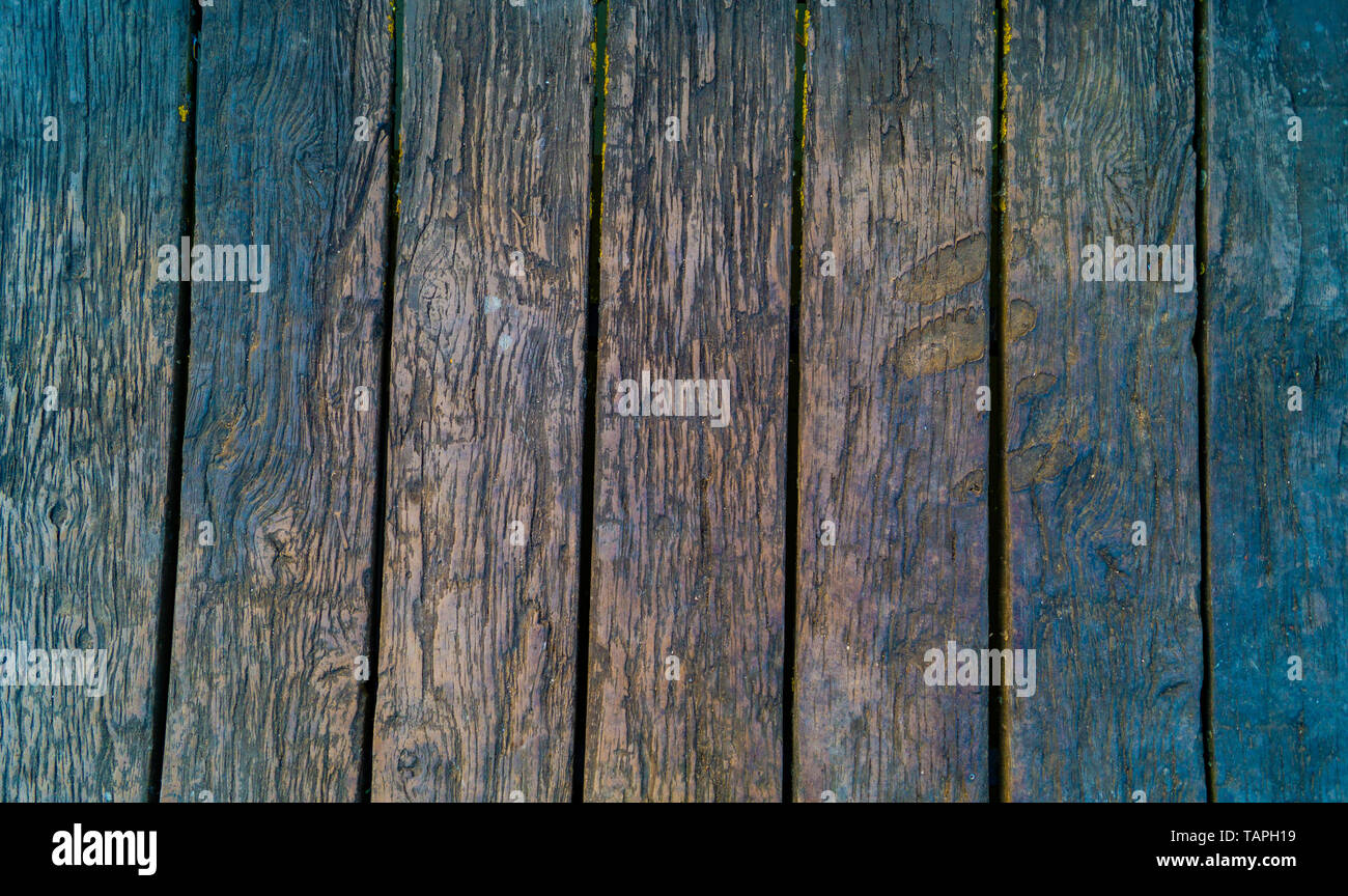 Top down view of old wooden pier planks forming wooden textured pattern ...