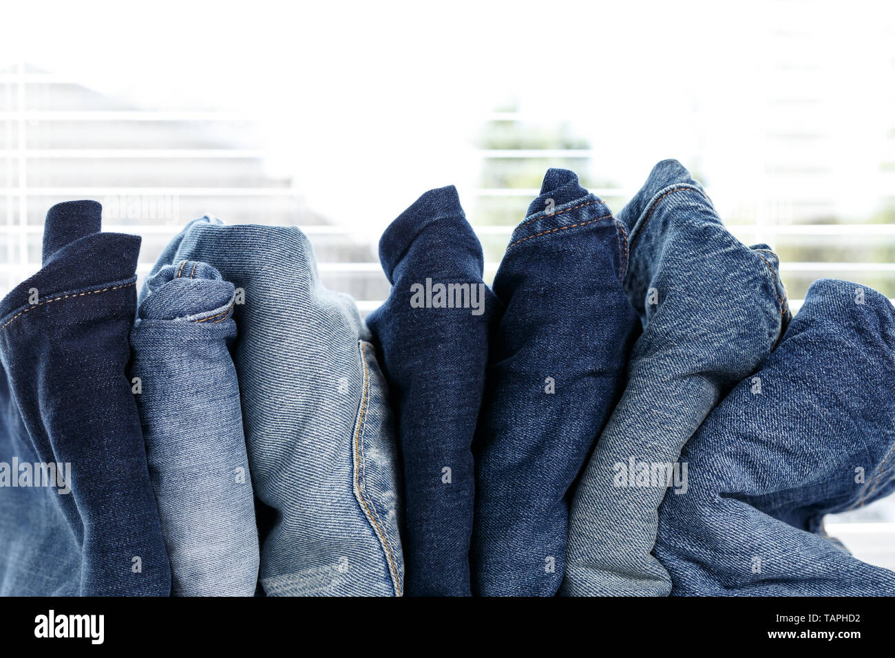 Pile of jeans Stock Photo - Alamy