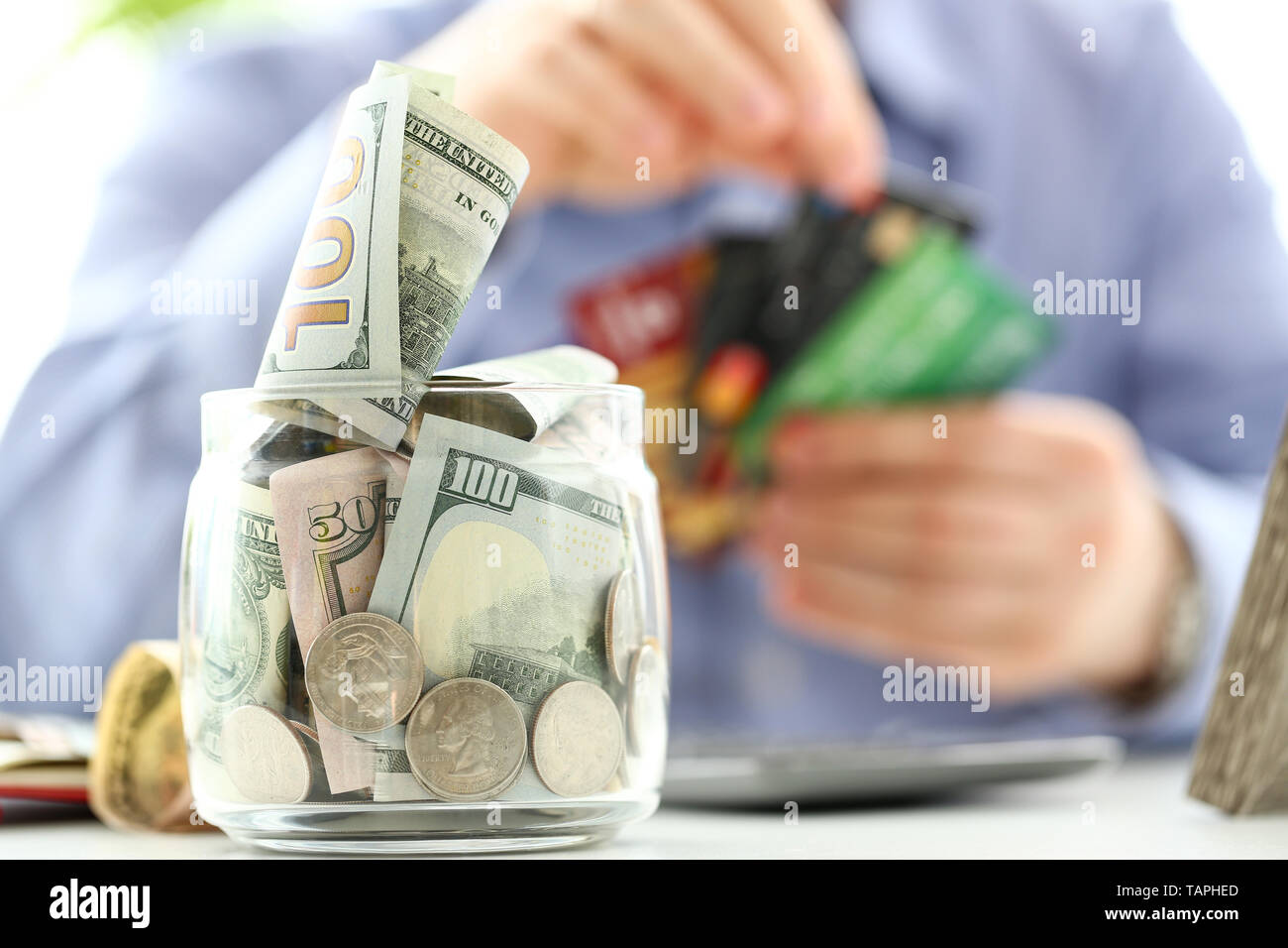 Hand money pot hi-res stock photography and images - Alamy