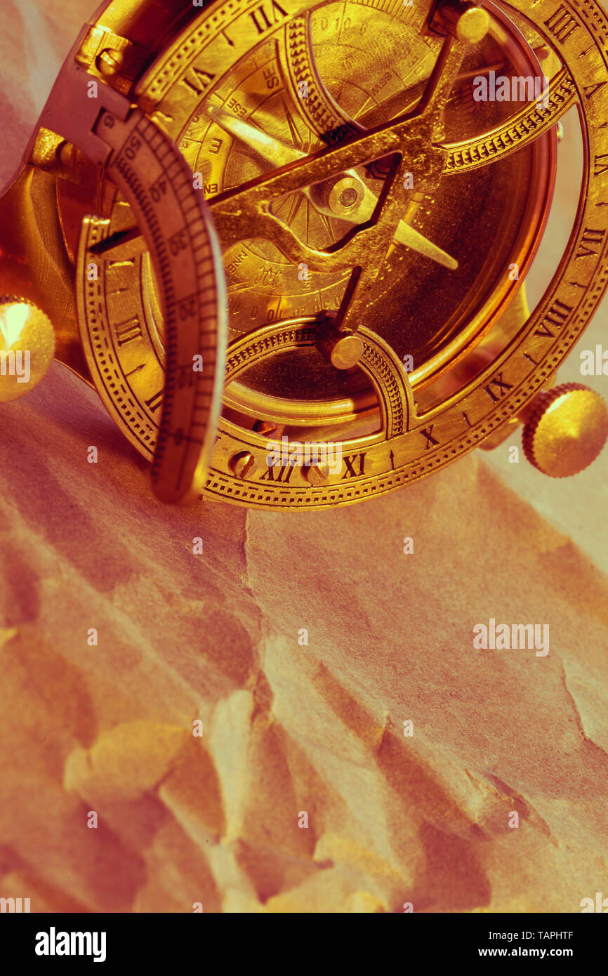 antique compass on vintage paper background Stock Photo - Alamy