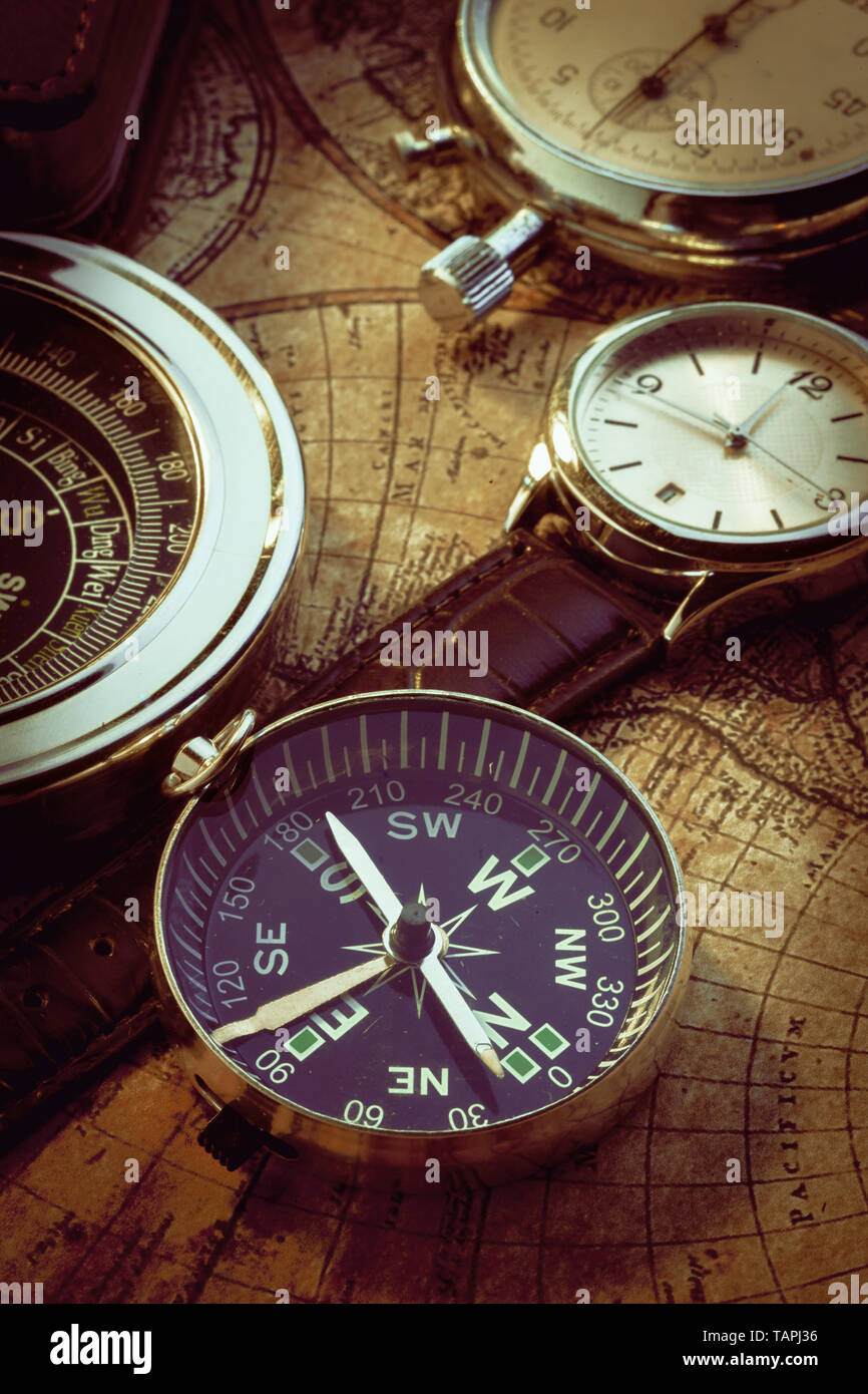 Old vintage compass and travel instruments on ancient map Stock Photo ...