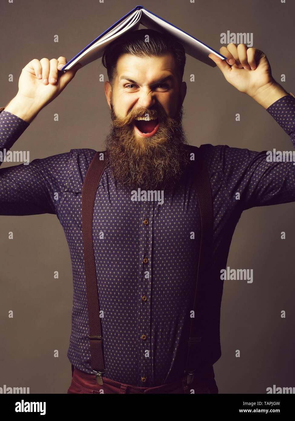 Man with journal on head Stock Photo - Alamy