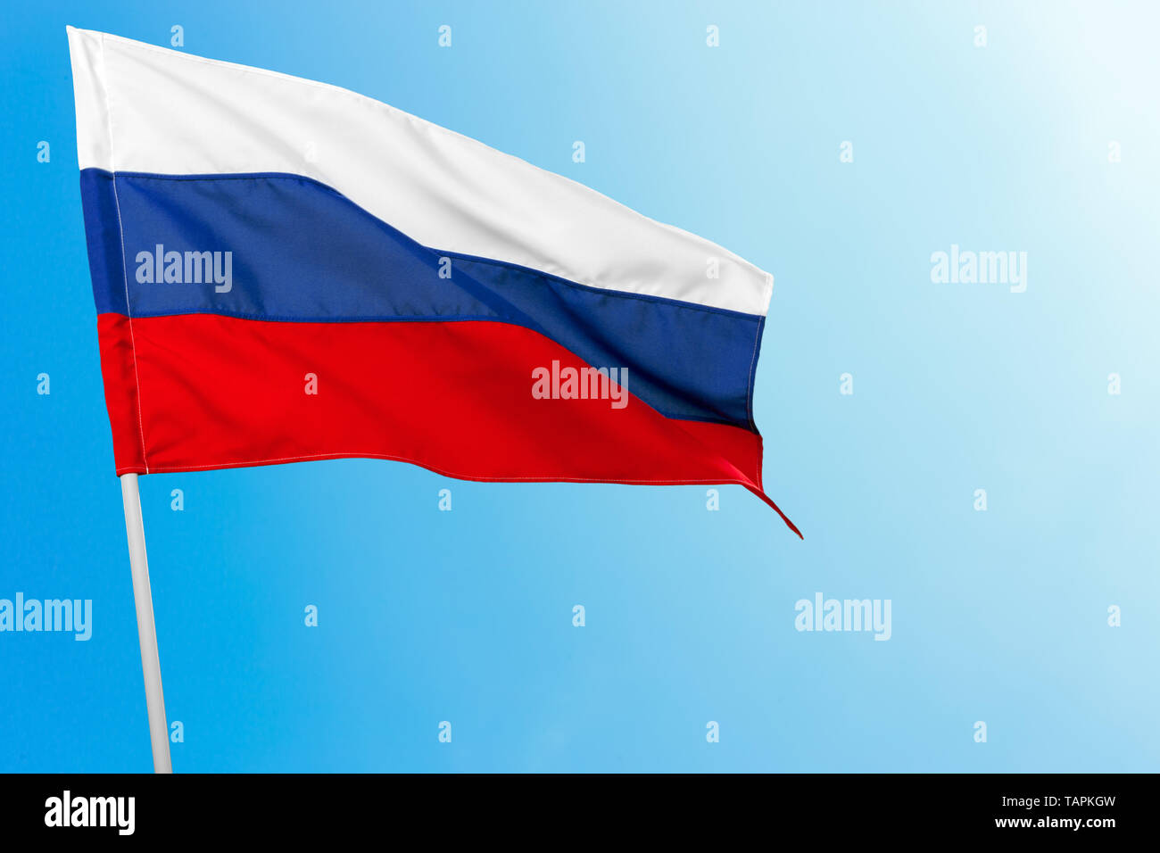 Russian flag against blue sky Stock Photo - Alamy