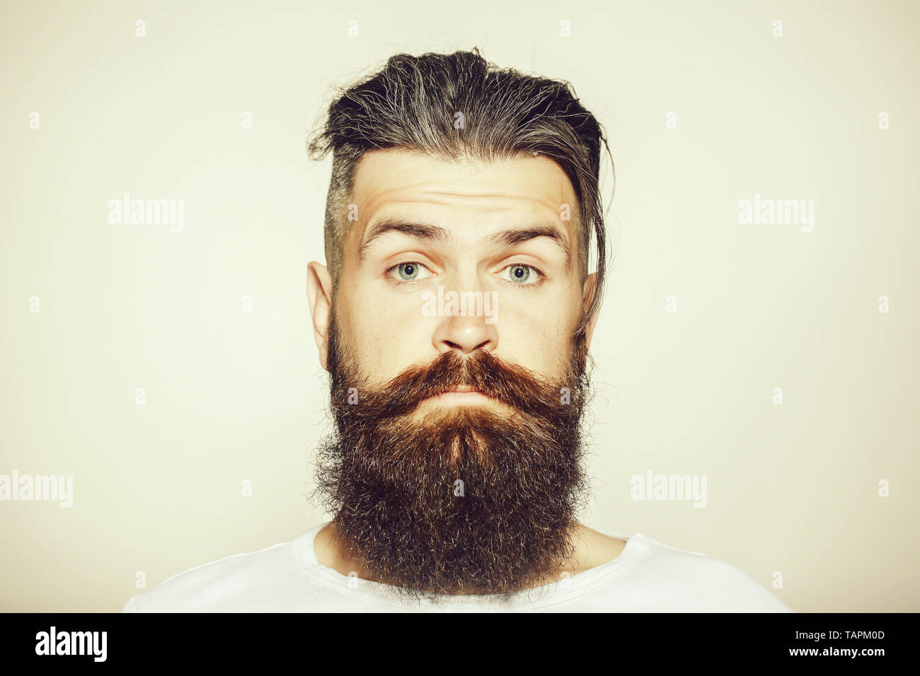Surprised bearded man Stock Photo - Alamy