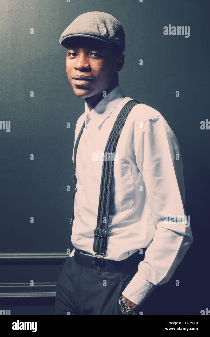 Smiling happy dark skinned stylish male Stock Photo - Alamy